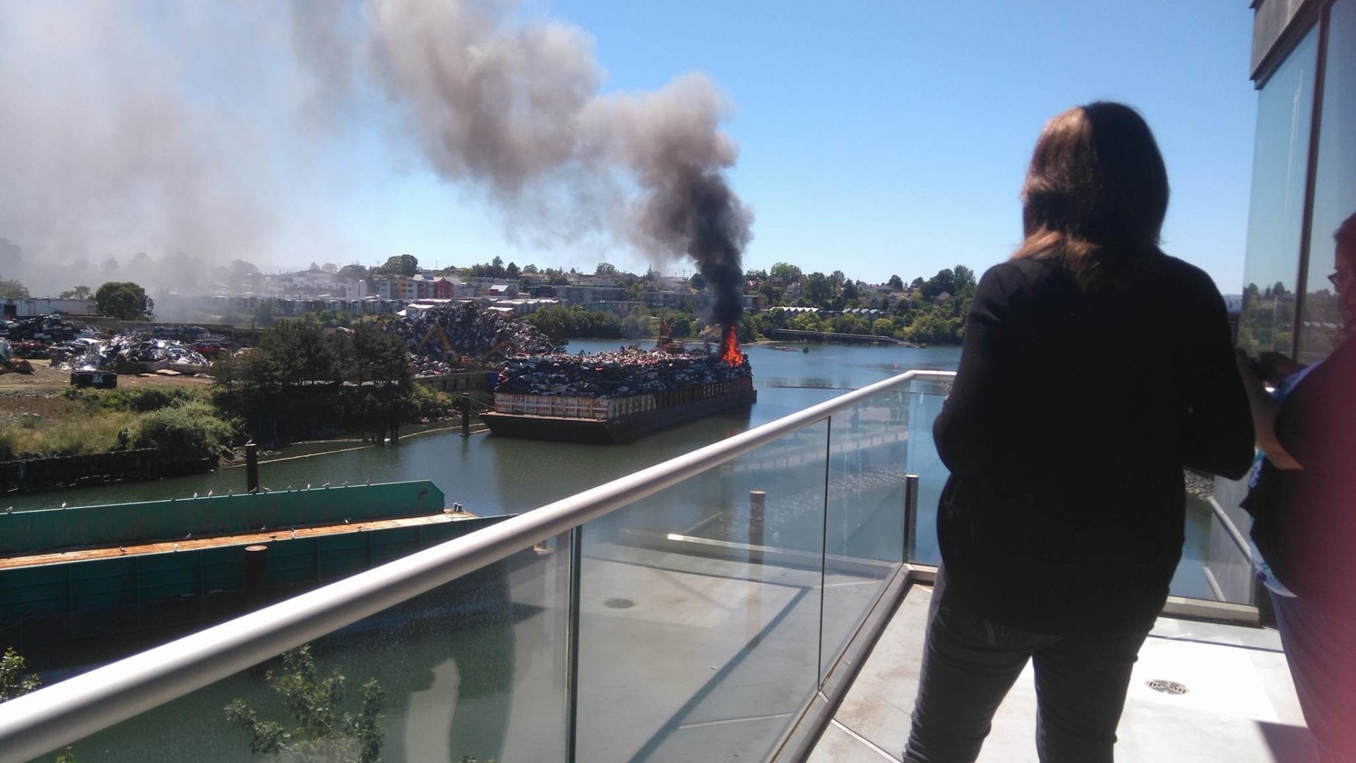 Photos and videos of a barge fire in the Gorge Waterway