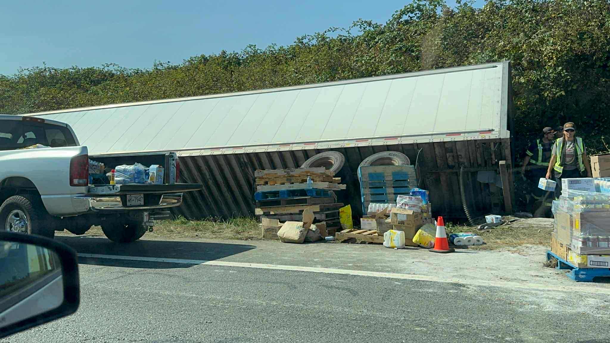 Cleanup underway after semi-truck tips into ditch on Pat Bay Highway ...